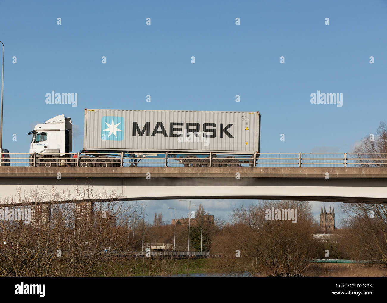 Containerised goods being transported on the road in a Maersk container ...