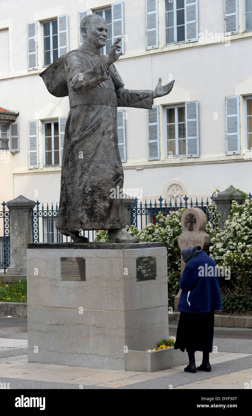 Statue of former Pope John Paul II, located in the yard of the Basilica ...