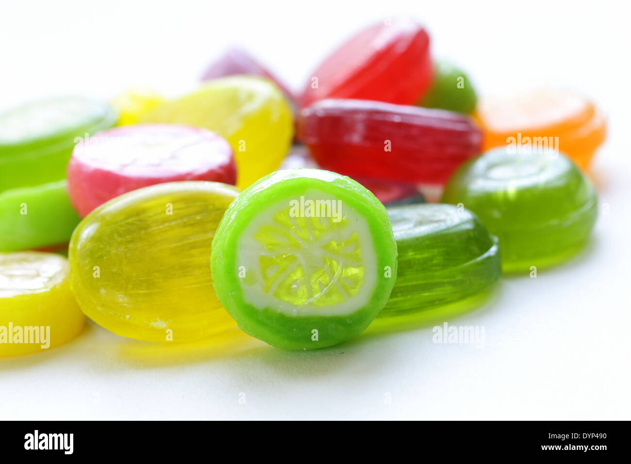 colored caramel fruit candies on a white background Stock Photo - Alamy