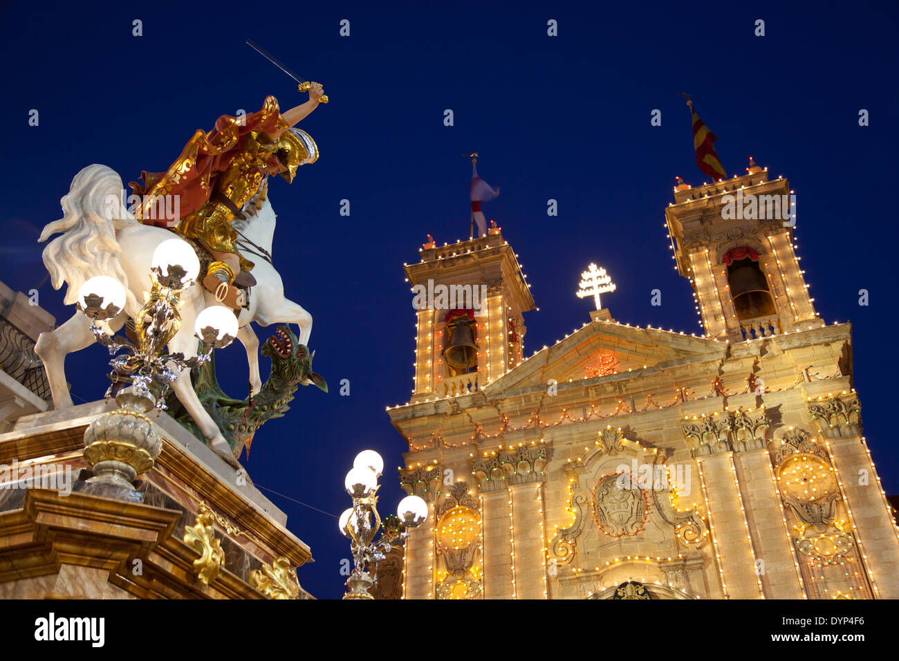 Statue of St George slaying the dragon mounted on a pedestal during the ...