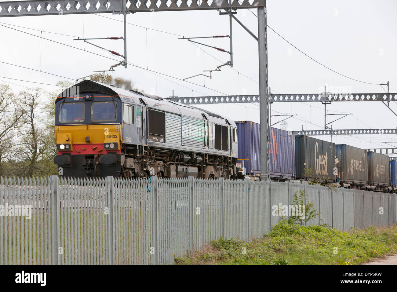 A freight train hauls containerised goods along the West Coast Main ...