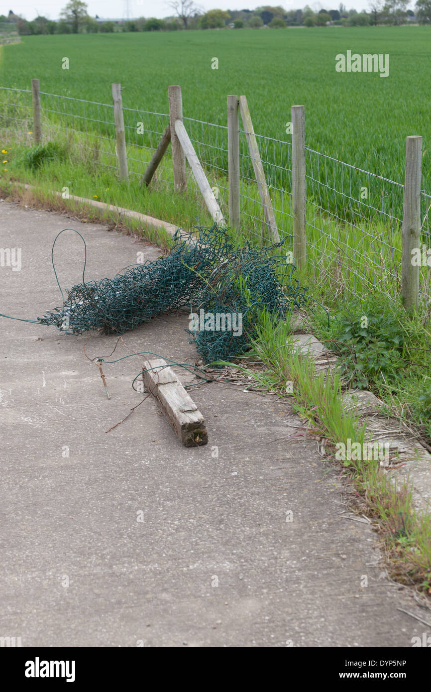 Flytipped chainlink fencing dumped next to farmland Stock Photo - Alamy