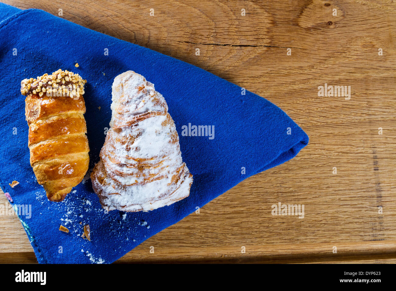 Typical continental breakfast with sugar-coated cannoli and croissants ...