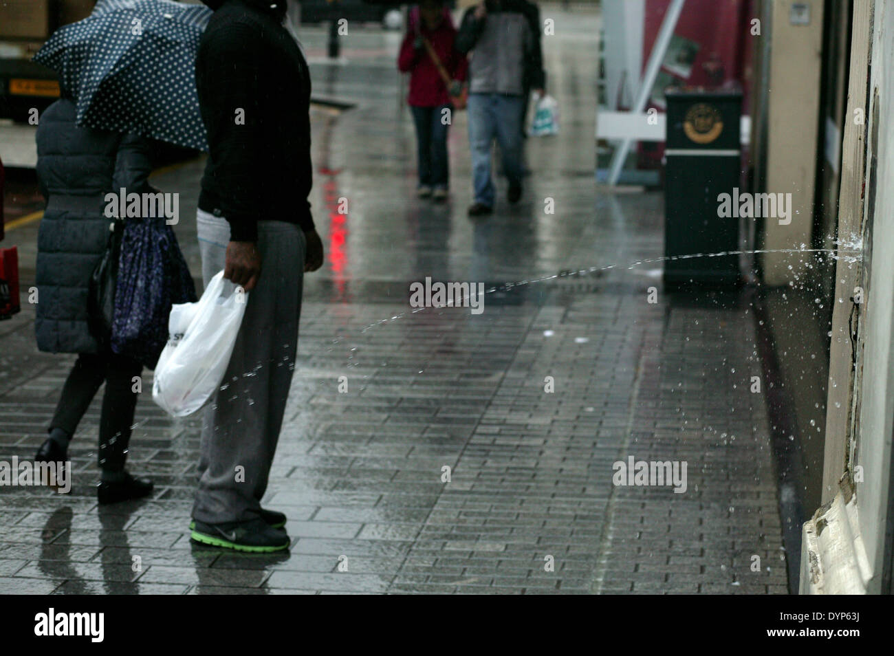 Donegall Place,Belfast,UK 11th Oct 2012. Water spurting out of a hole ...