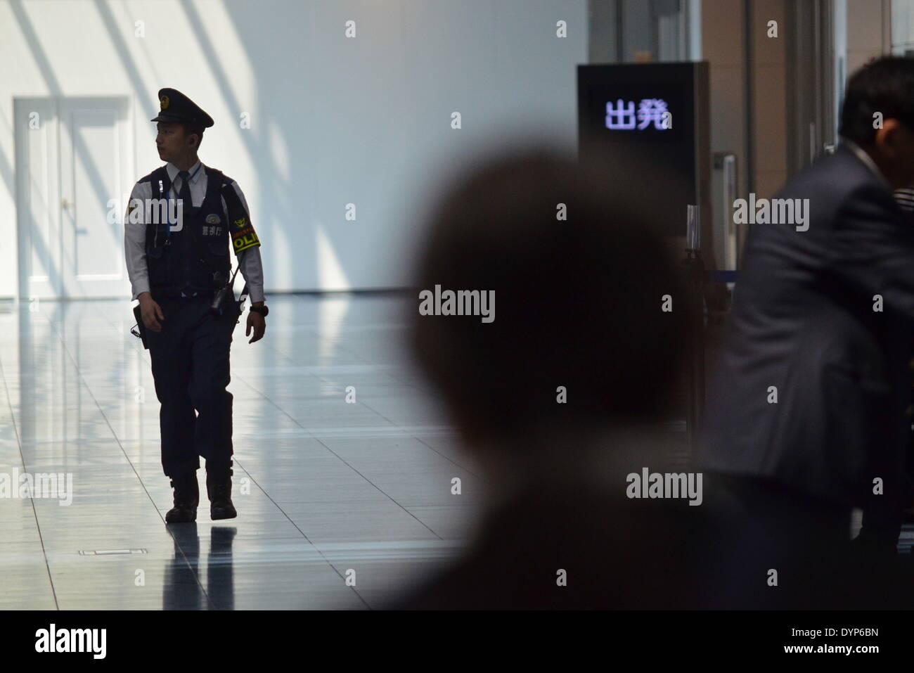 Ota, Tokyo, Japan. 23rd Apr, 2014. A Japanese police officer walks ...
