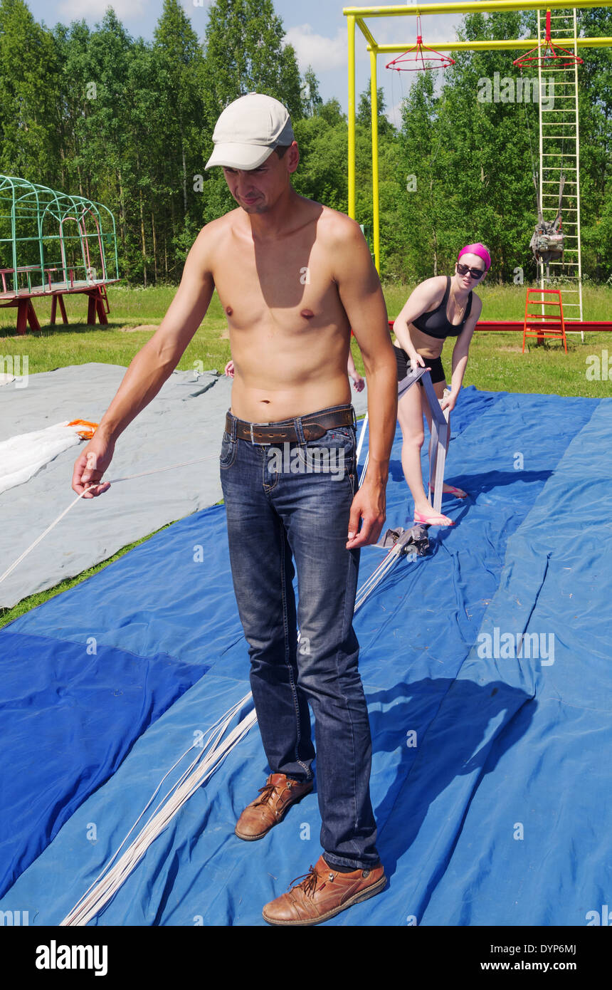 One day with parachutist in airfield. Parachute packing Stock Photo - Alamy