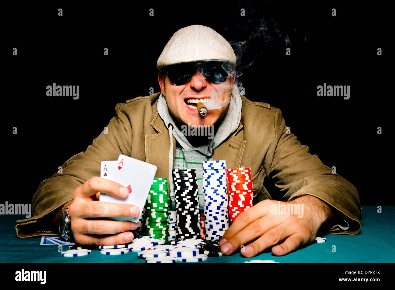 Poker hand holding smoking aces hi-res stock photography and images - Alamy