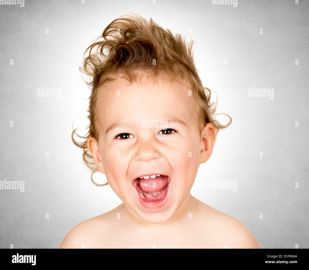 Little child with funny hairstyle screaming Stock Photo - Alamy