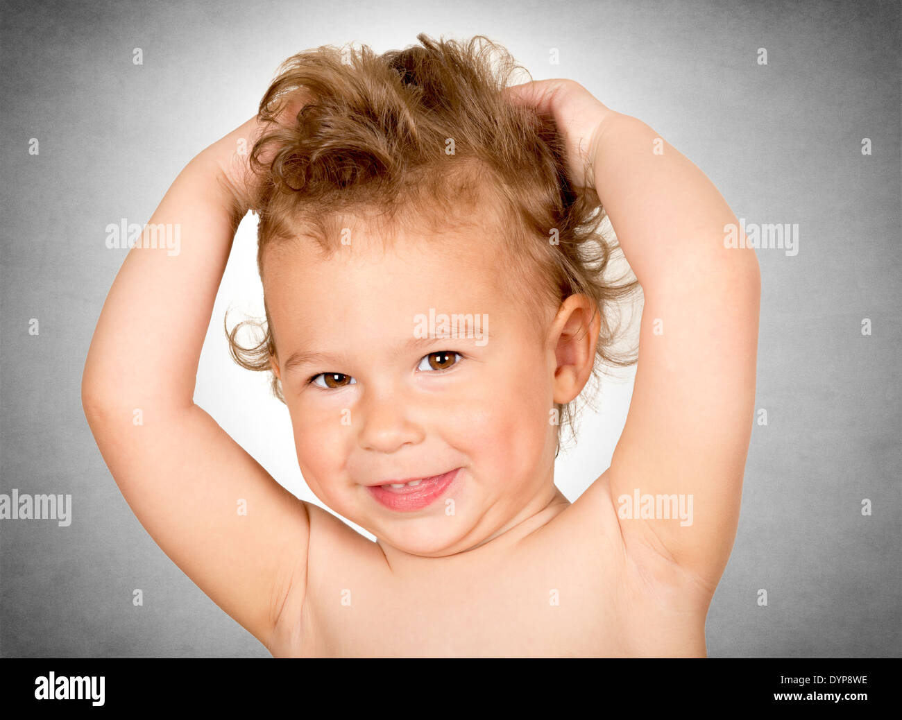 Child with funny hairstyle holding hands on the head Stock Photo - Alamy