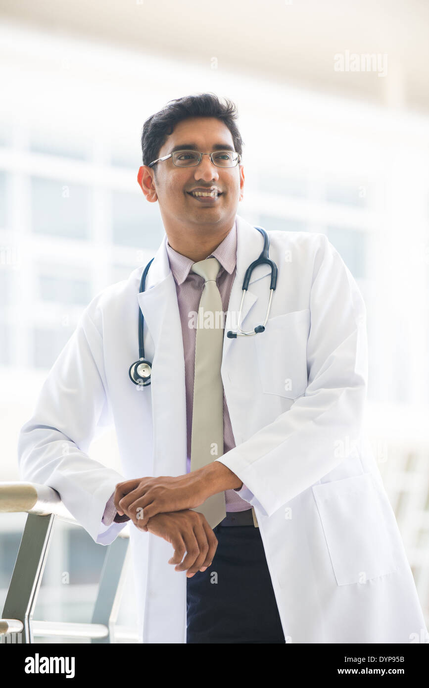 indian male doctor smiling with hospital background Stock Photo - Alamy
