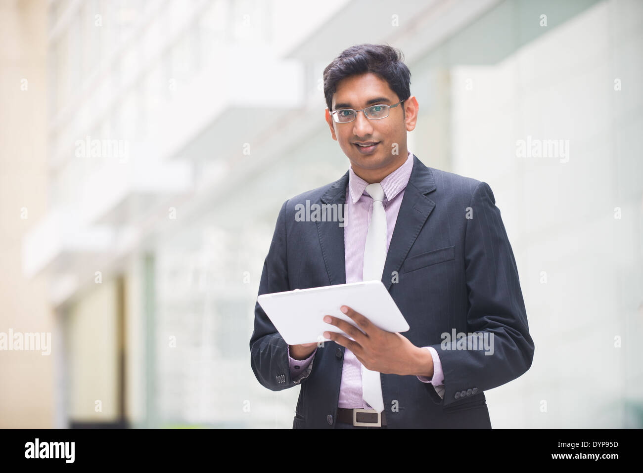 indian business male with a tablet Stock Photo - Alamy
