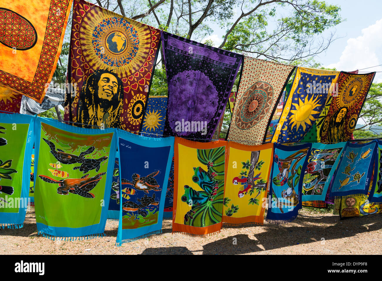 Colorful printed sarongs hanging on strings for sale. Costa Rica Stock ...