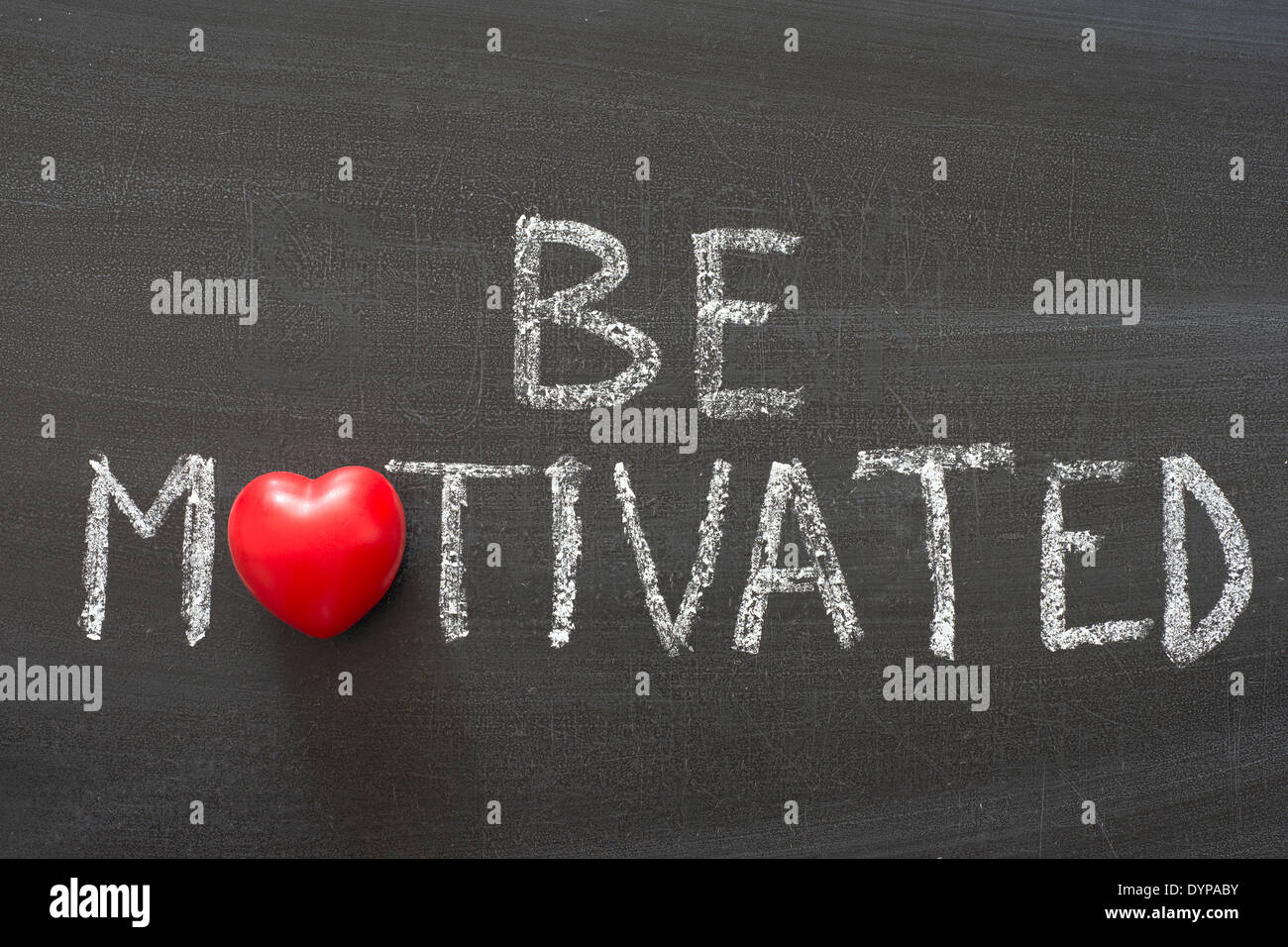 be motivated phrase handwritten on school blackboard Stock Photo - Alamy