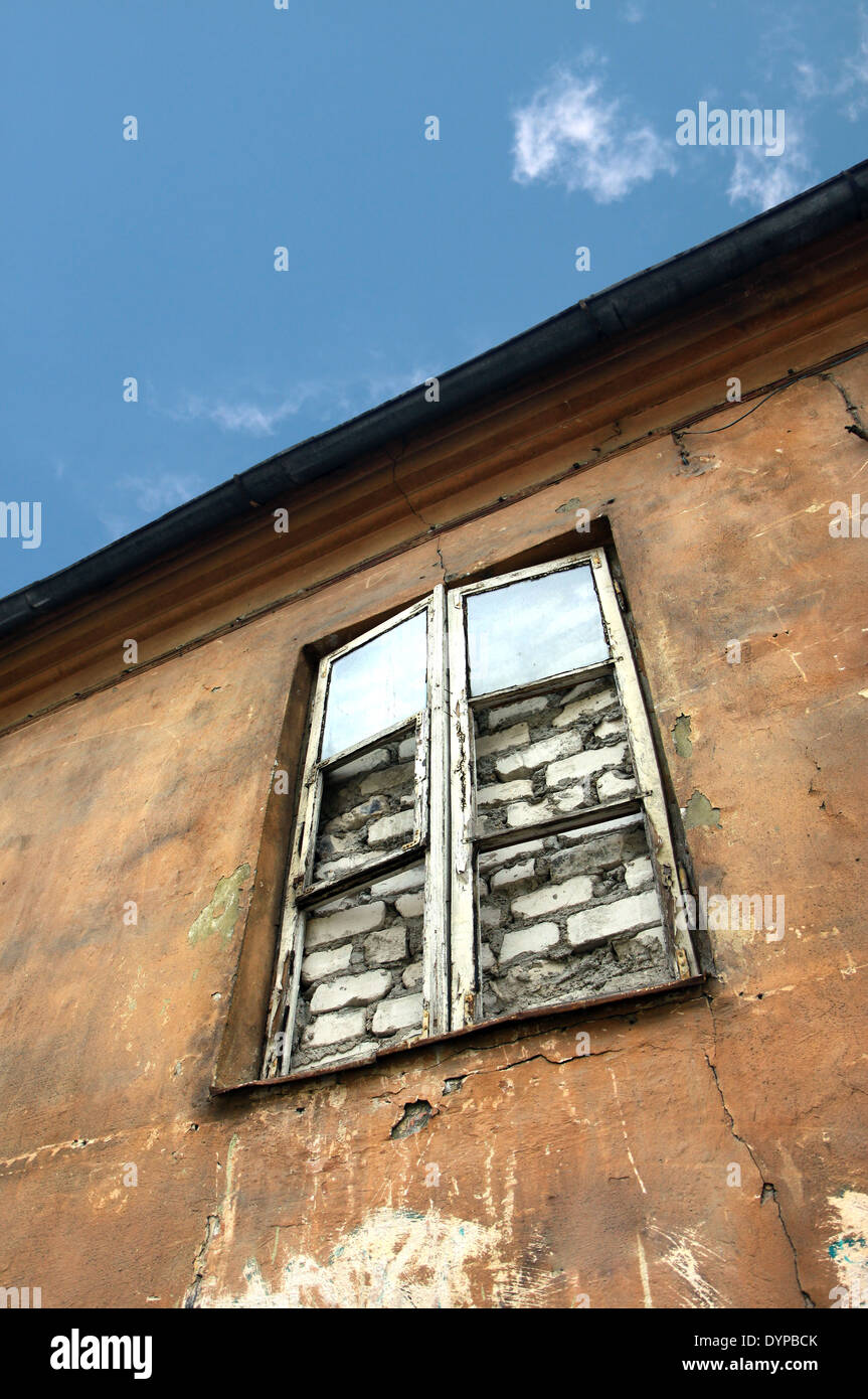 Low angle view at bricked over window of an old abandoned house Stock ...