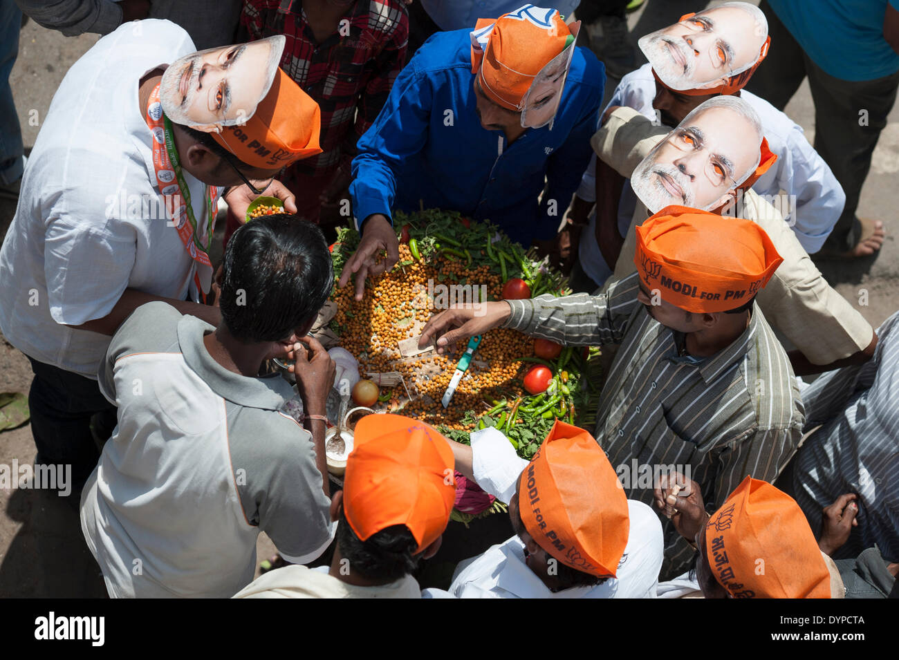 Varanasi, Uttar Pradesh, India. 24th April, 2014. Modi fans crowd round ...