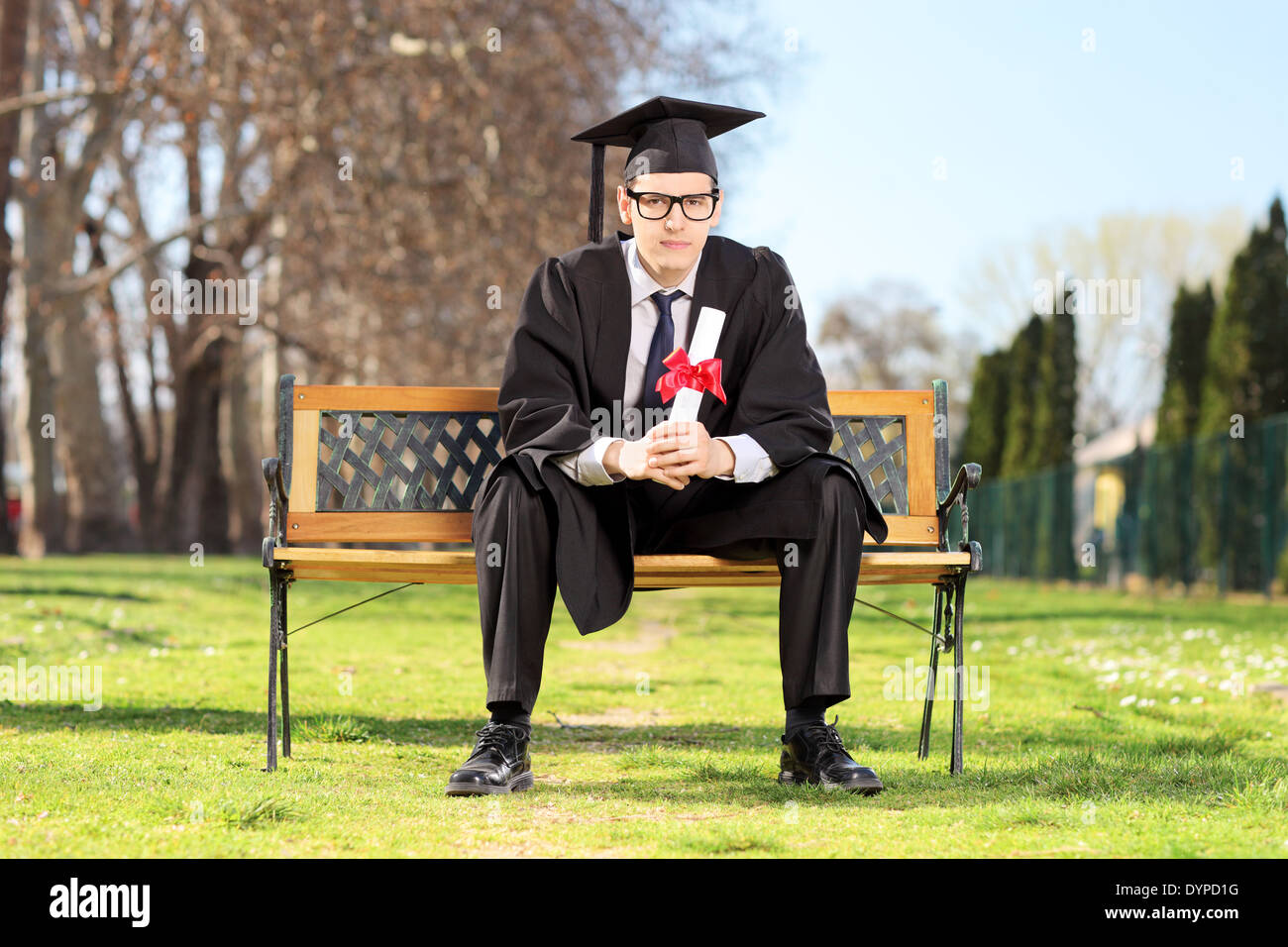 Male college graduate posing outdoors hi-res stock photography and ...