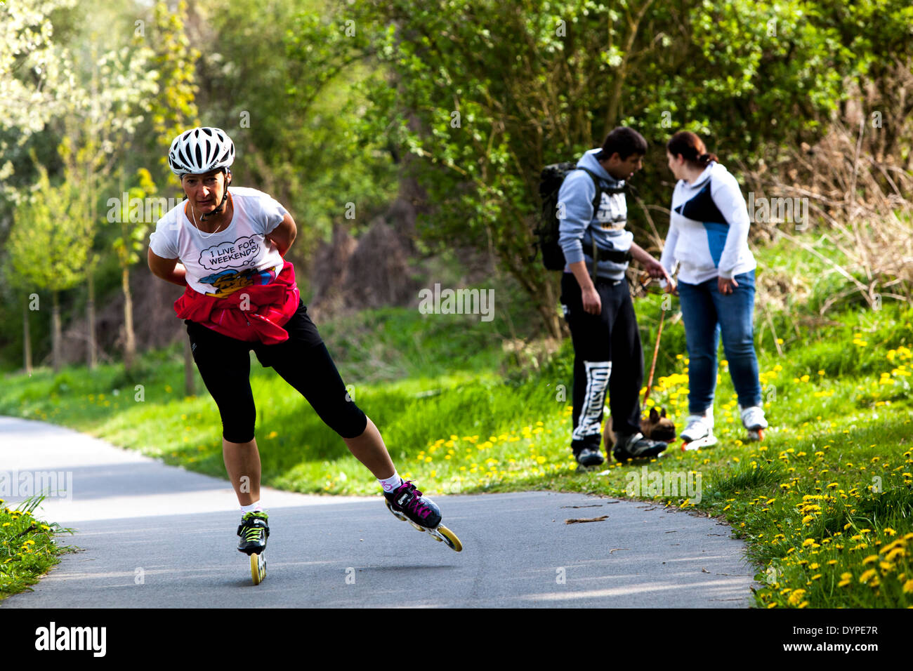 Active people on cycle path in roller skates Stock Photo - Alamy
