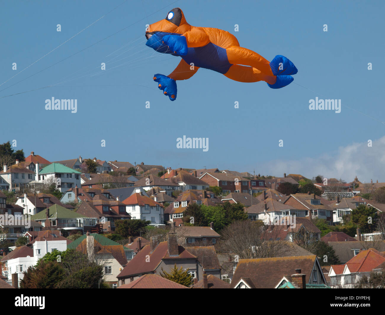 A strange frog-shaped kite is flown over the East Sussex village of ...
