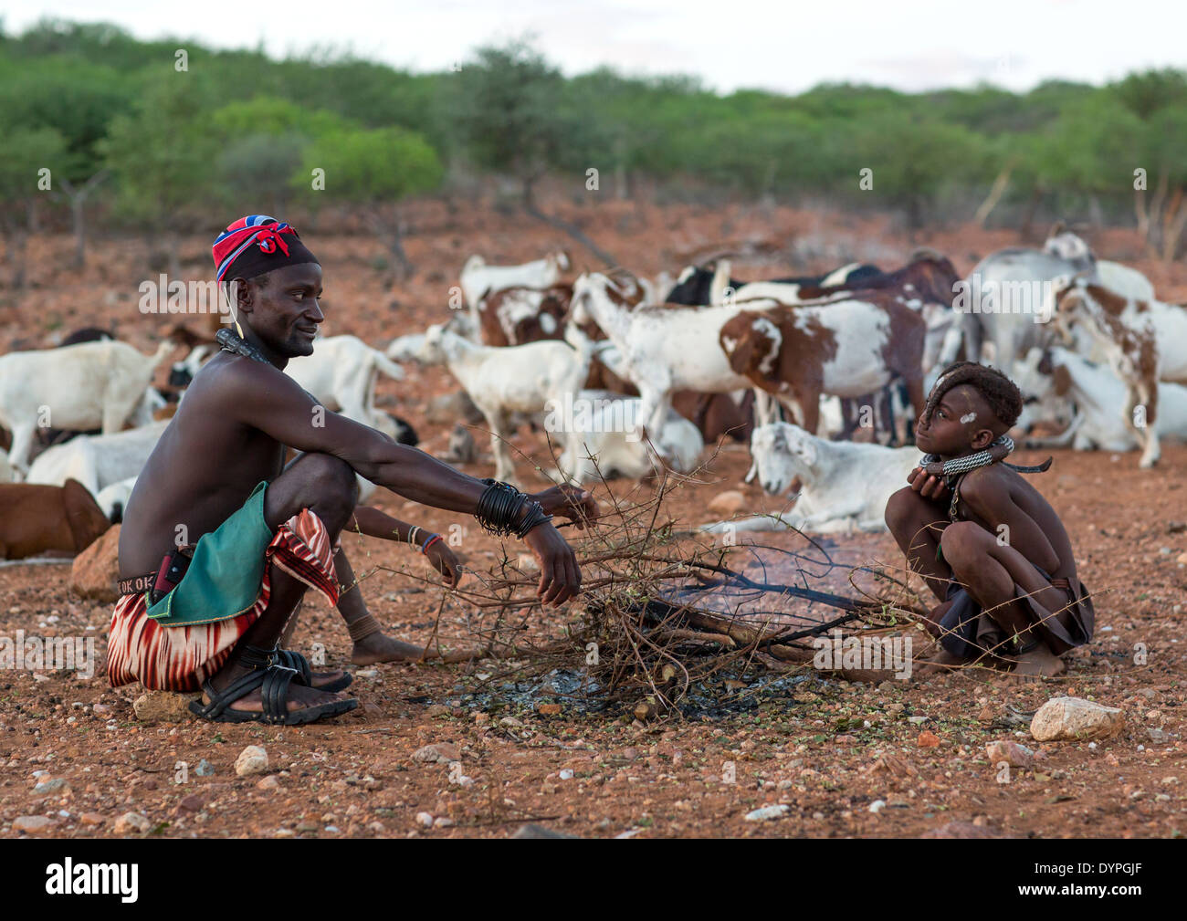 Himba Family In Front Of The Sacred Fire, Epupa, Namibia Stock Photo ...