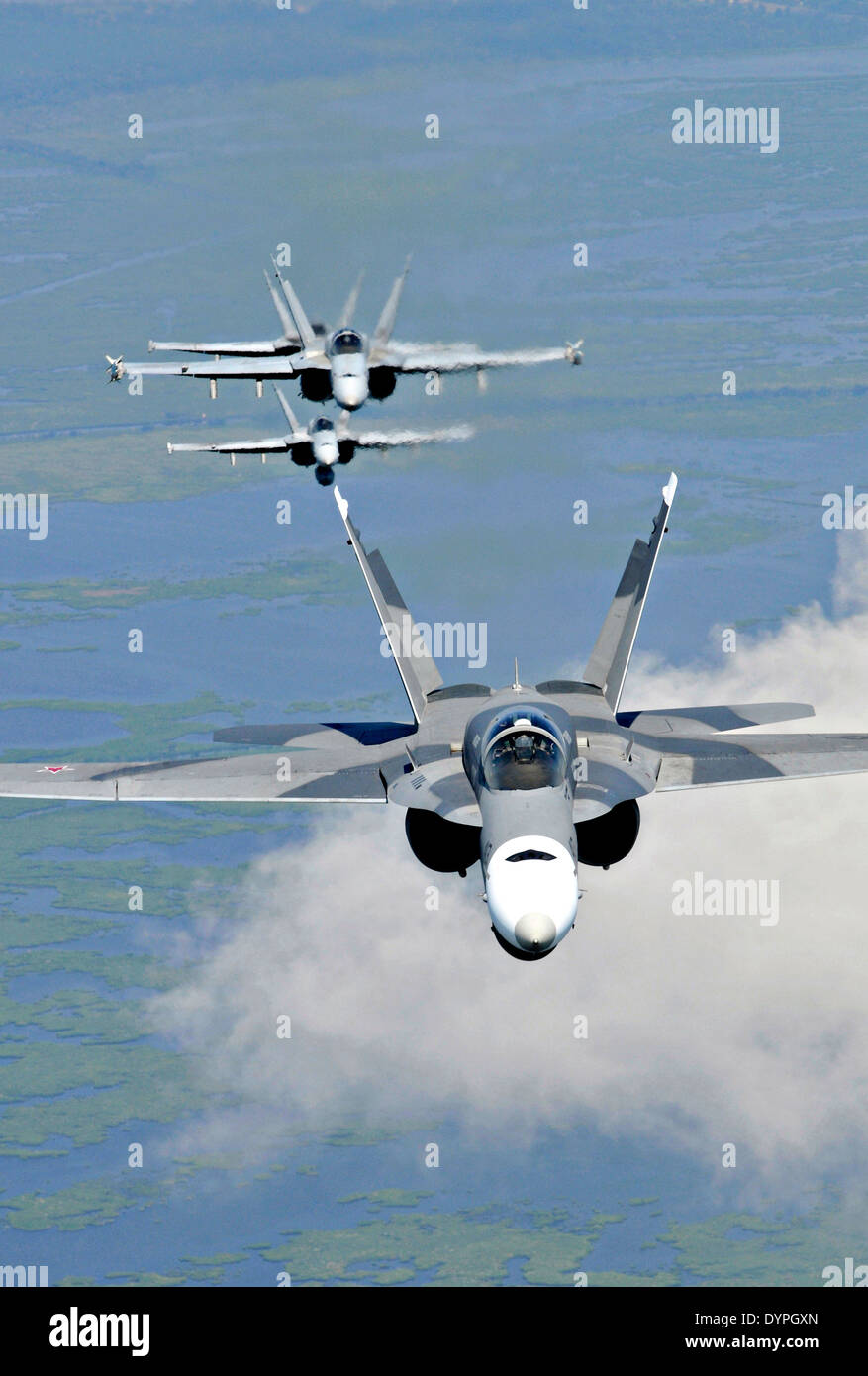 Four US Marine Corp F/A-18 Hornet fighter aircraft fly in formation ...