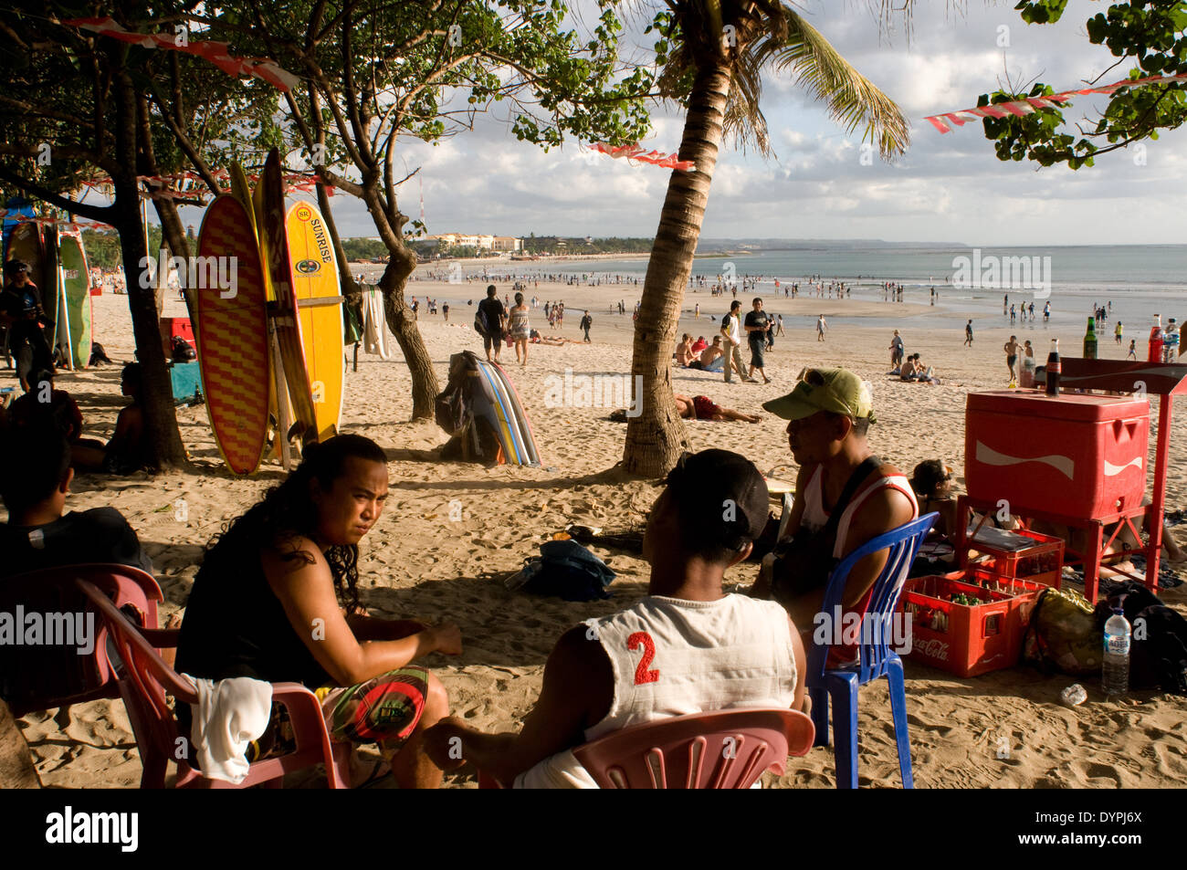 Surfers on the beach of Kuta. Surfing lessons. Bali. Kuta is a coastal ...