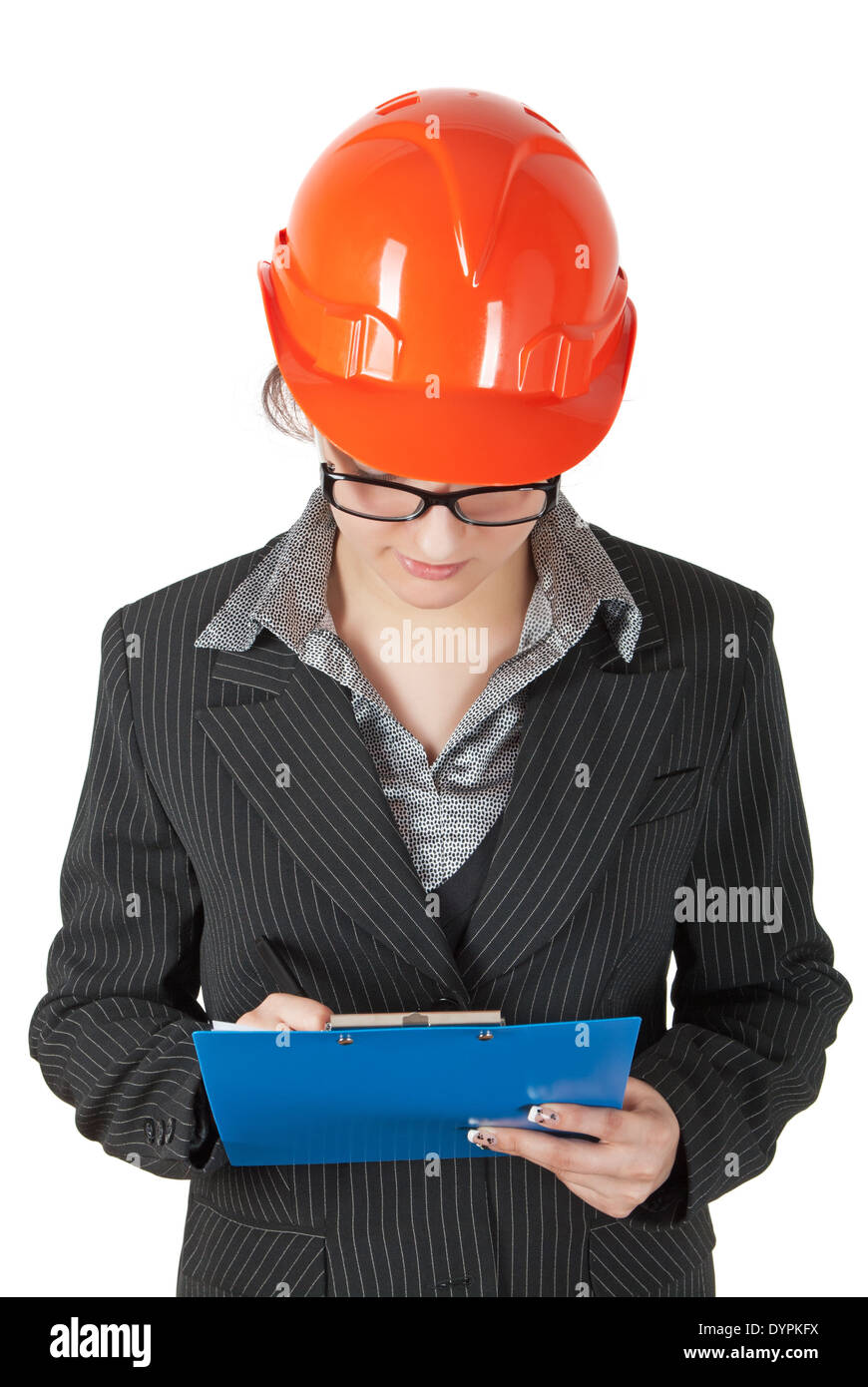 female superintendent in the construction helmet records the tablet ...