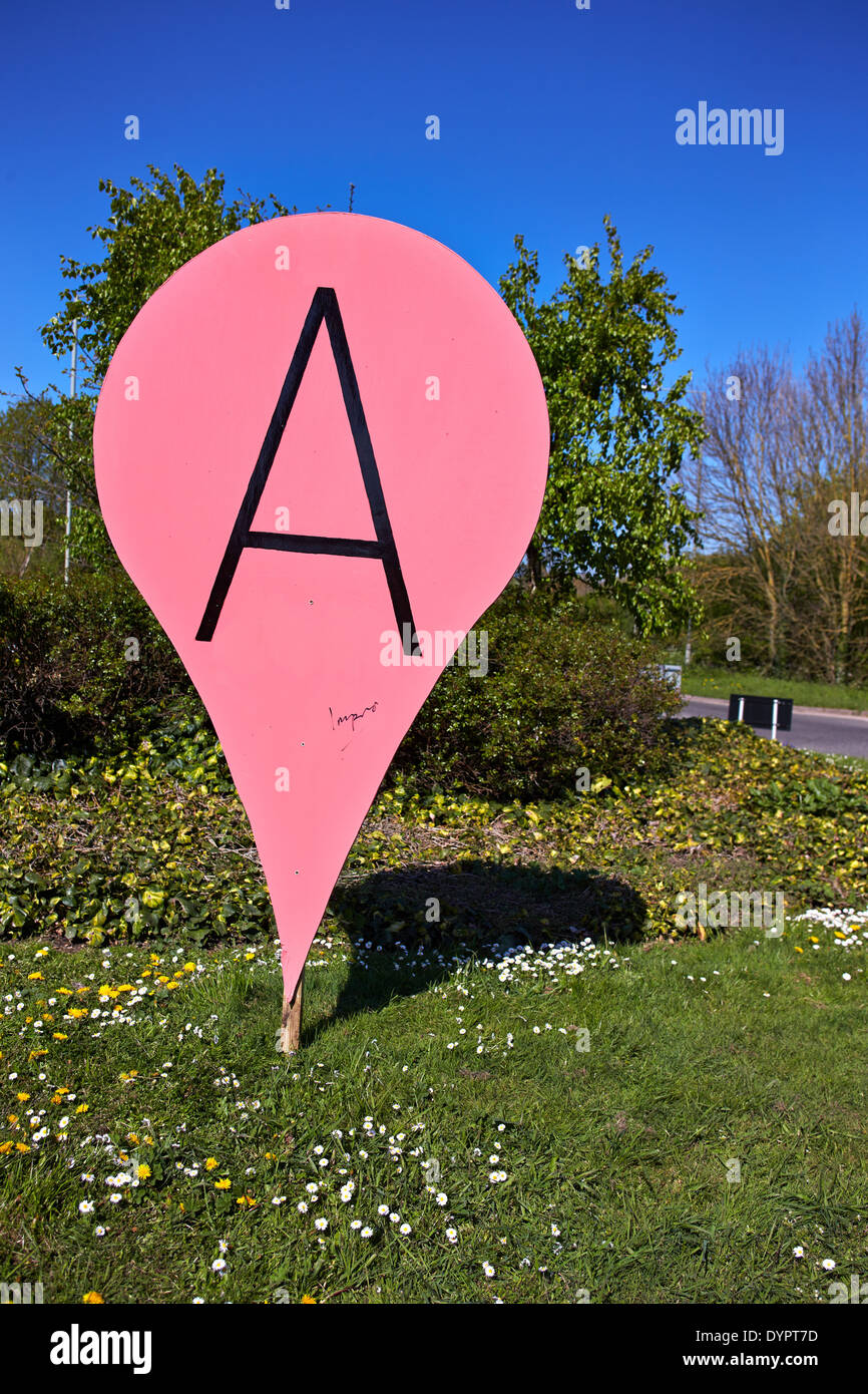 A sign shaped like a life sized Google maps marker or pin has been ...