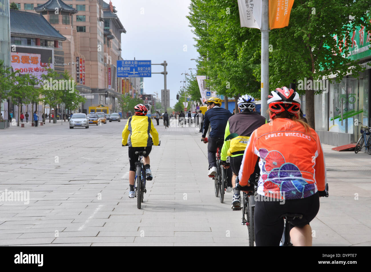 Three Australian cyclist and their Chinese guide cycling in Beijing ...