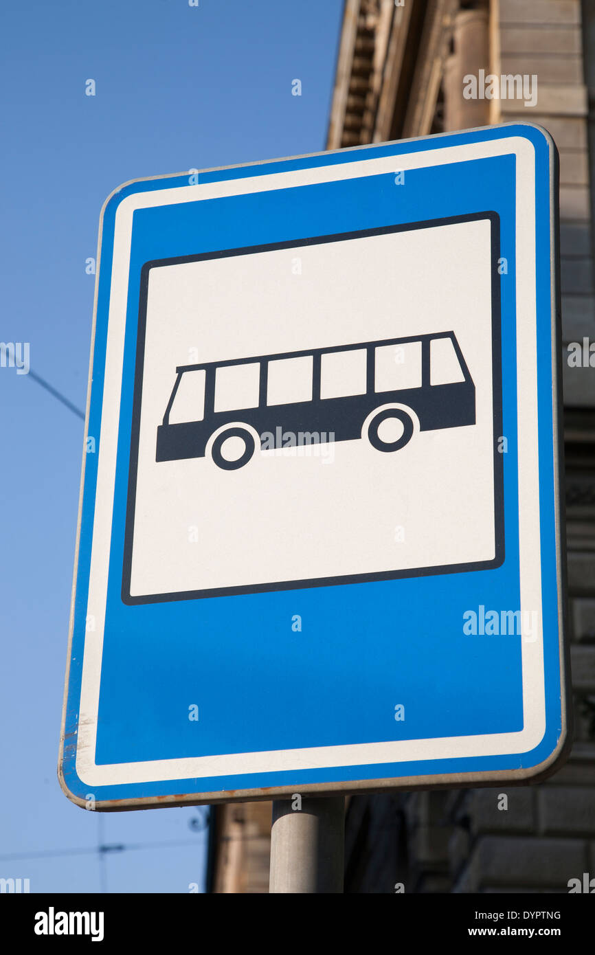 Blue Bus Stop Sign in Urban Setting Stock Photo - Alamy