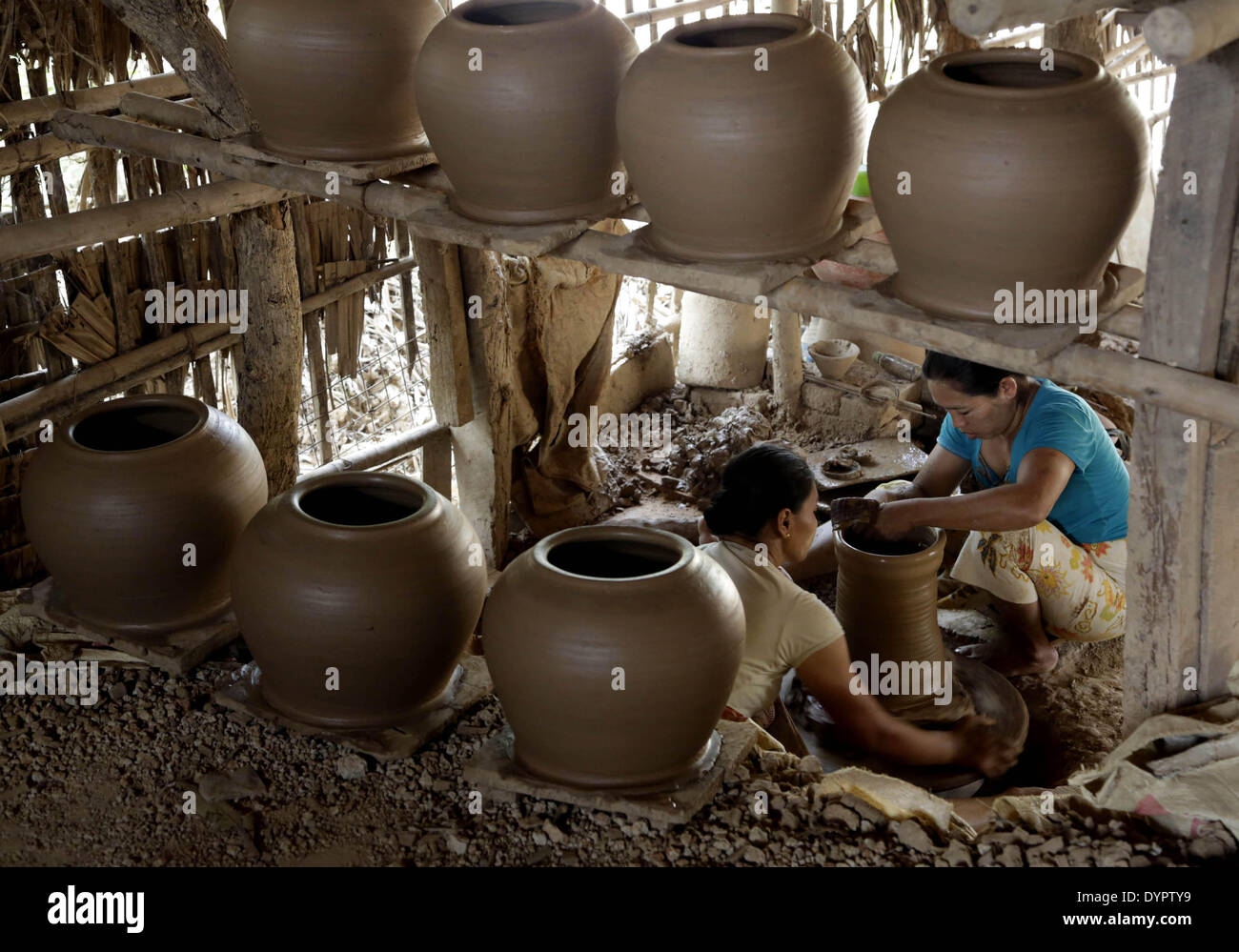 Yangon, Myanmar. 24th Apr, 2014. Workers make earthenware at a pottery ...