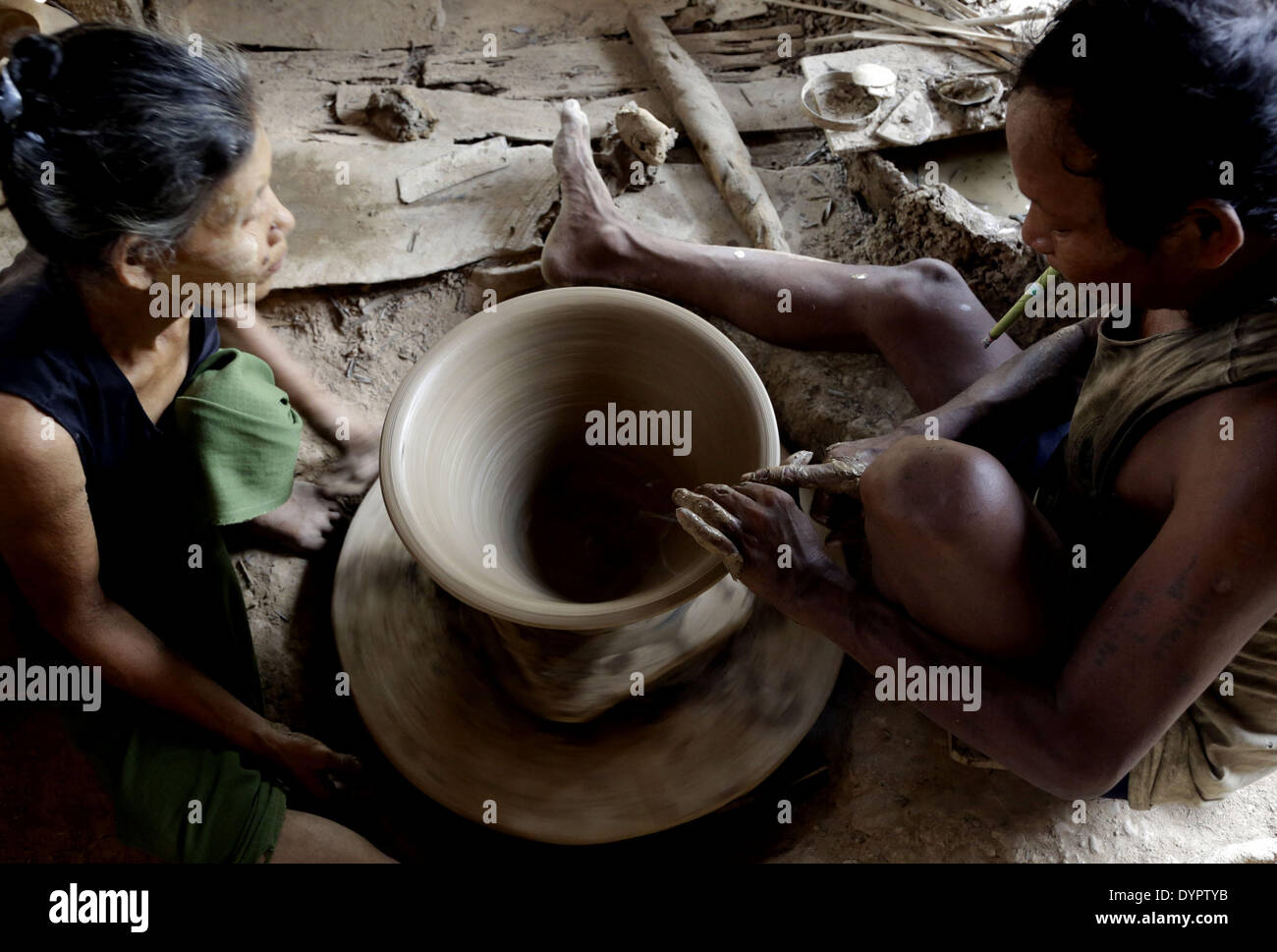 Yangon, Myanmar. 24th Apr, 2014. Workers make earthenware at a pottery ...