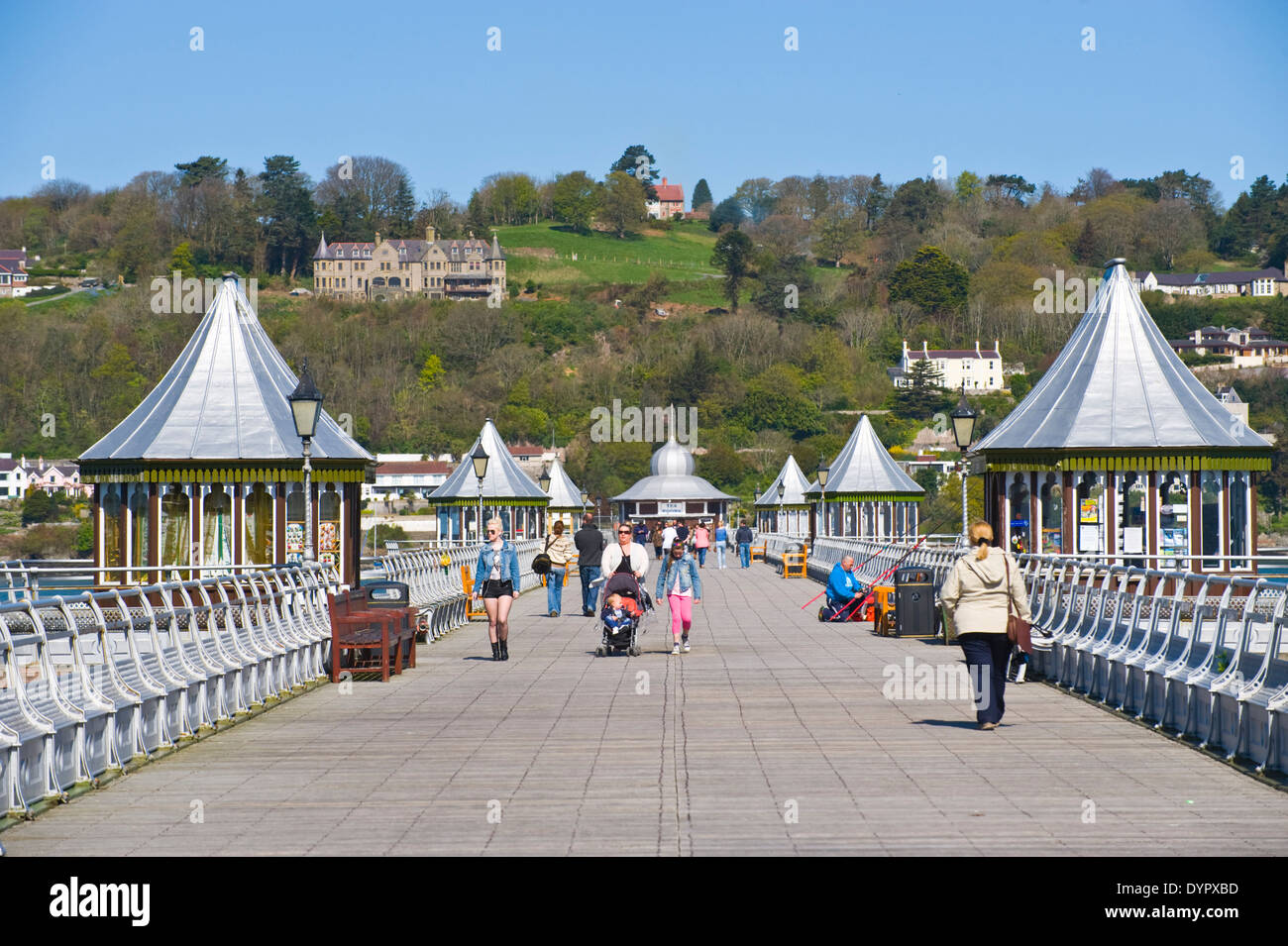 People walking on Bangor Pier on the Menai Strait at Bangor Gwynedd ...