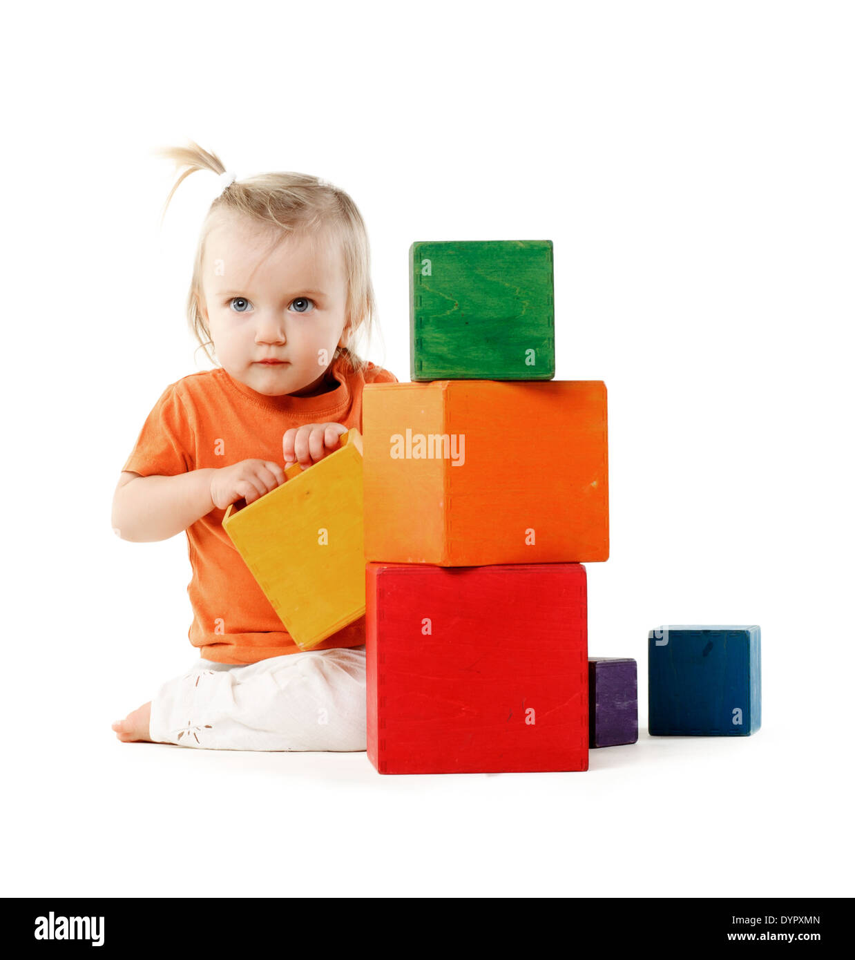 Little girl playing with cubes Stock Photo - Alamy