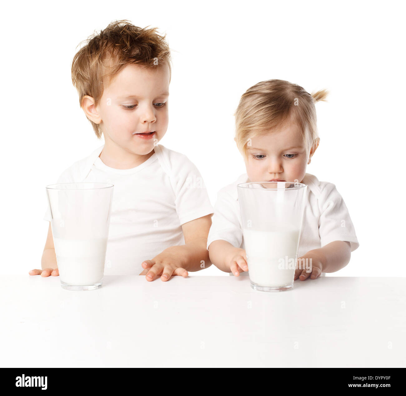children drink milk, isolated on white background Stock Photo - Alamy