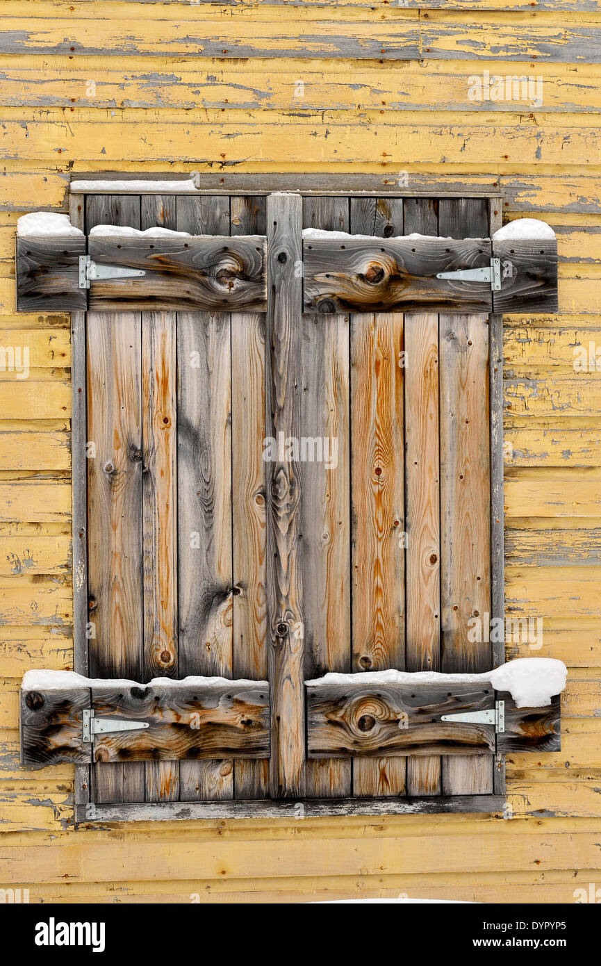 Board shutters covering a window in an old building Stock Photo - Alamy