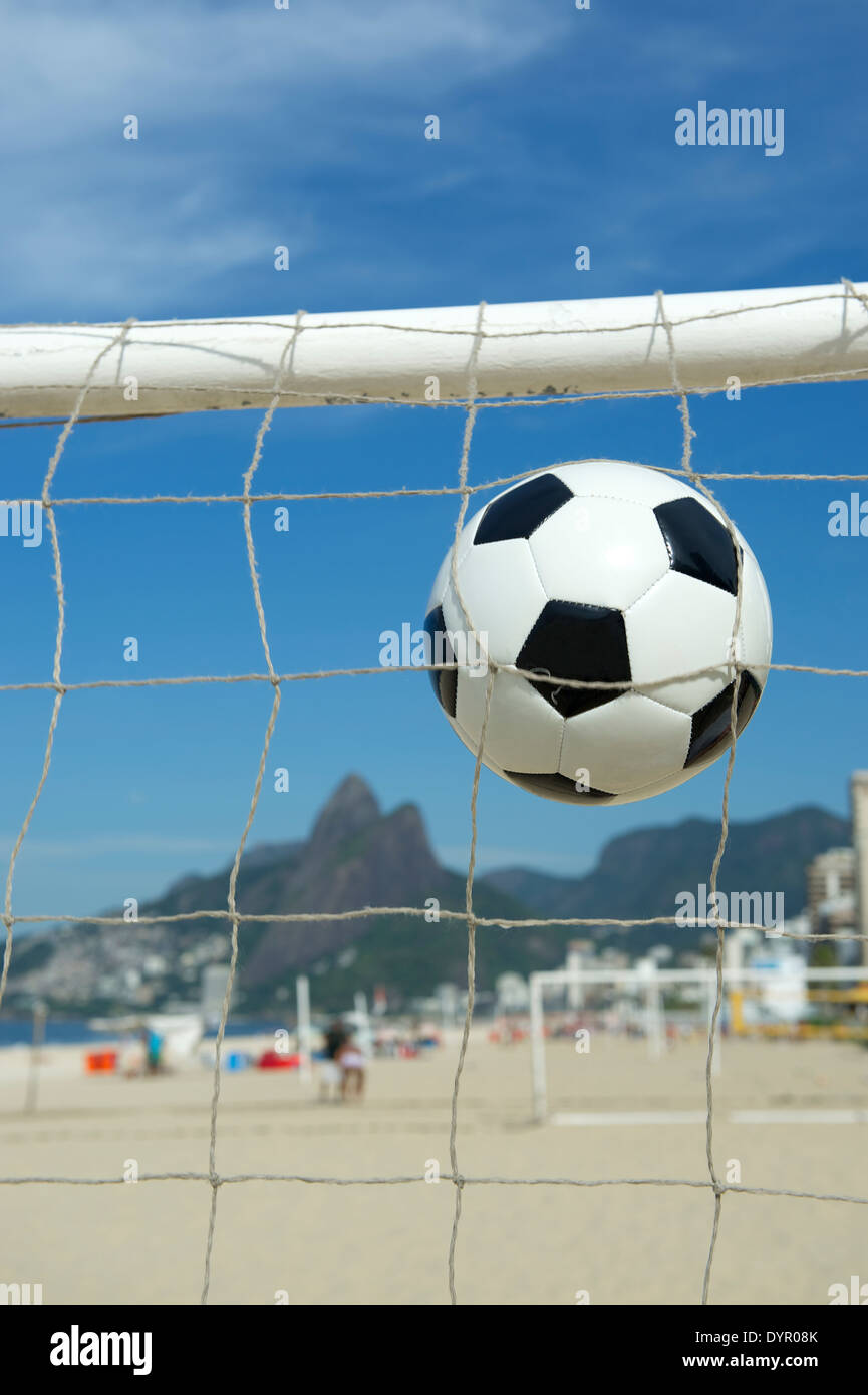 Soccer goal ball scoring in football net on the beach in Rio de Janeiro ...