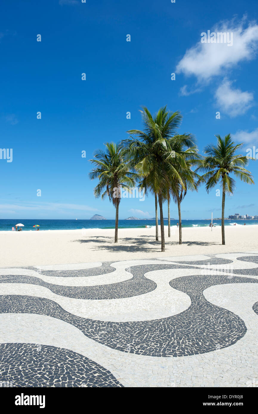 Iconic sidewalk tile pattern with palm trees at Copacabana Beach Rio de ...