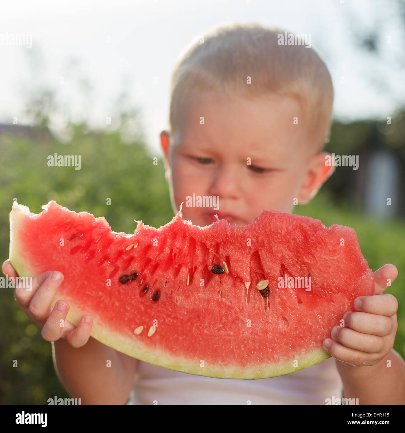 little baby eating watermelon outdoors Stock Photo - Alamy