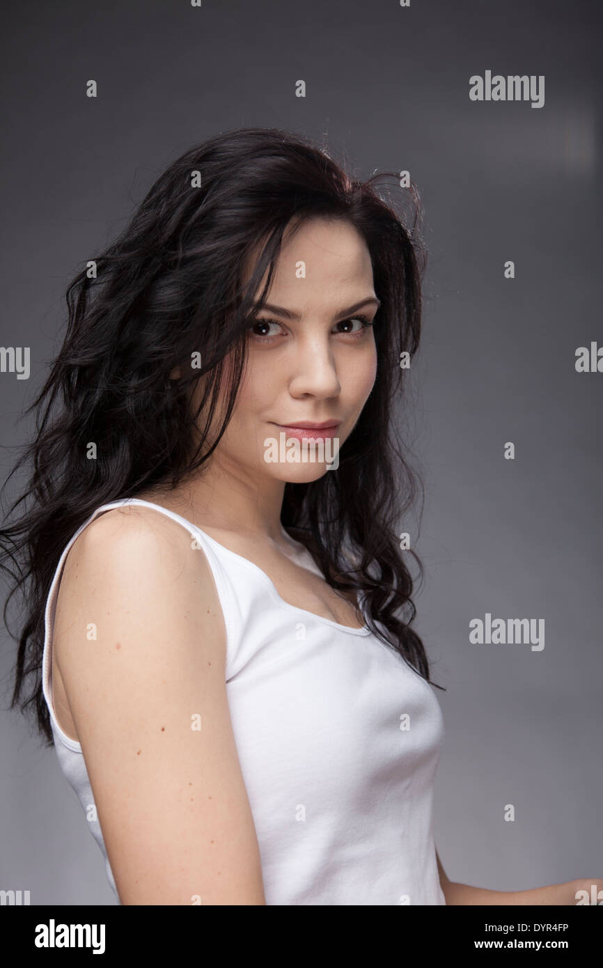 color image, portrait style, of a Caucasian girl with black hair ...