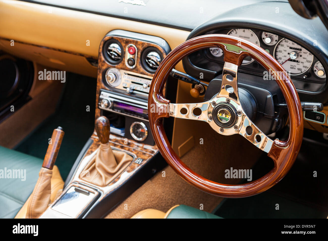 Inside view of a roadster classic car with its plush leather seats and ...