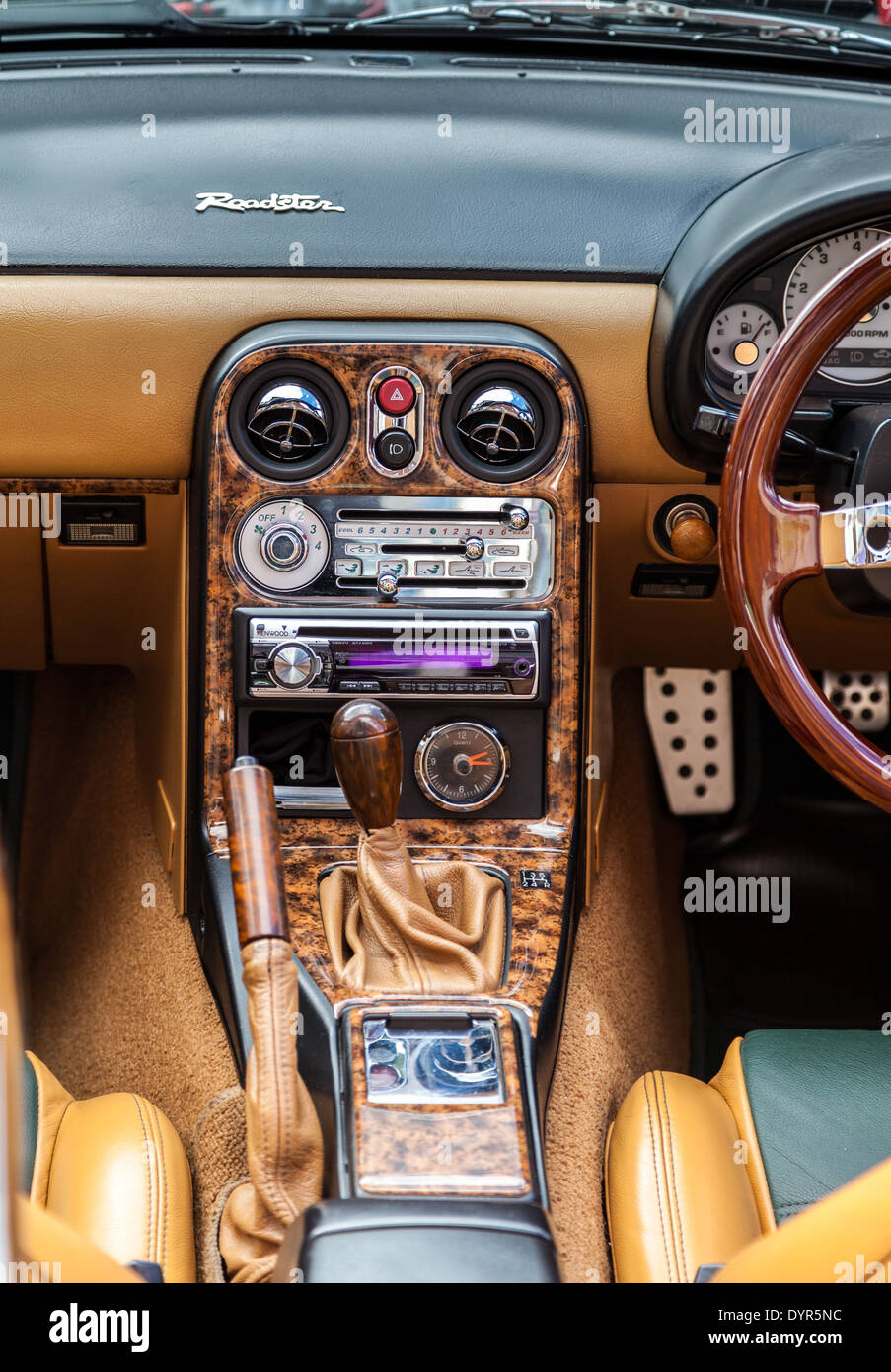 Inside view of a roadster classic car with its plush leather seats and ...