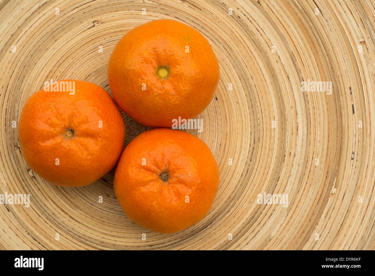 Still Life / Concept / Pattern - three tangerines on a patterned wooden ...