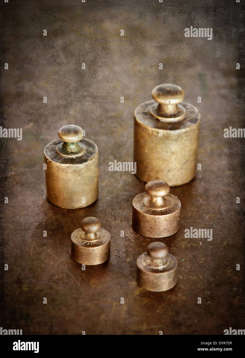 Vintage brass weights. Distressed texture for a retro feel Stock Photo ...