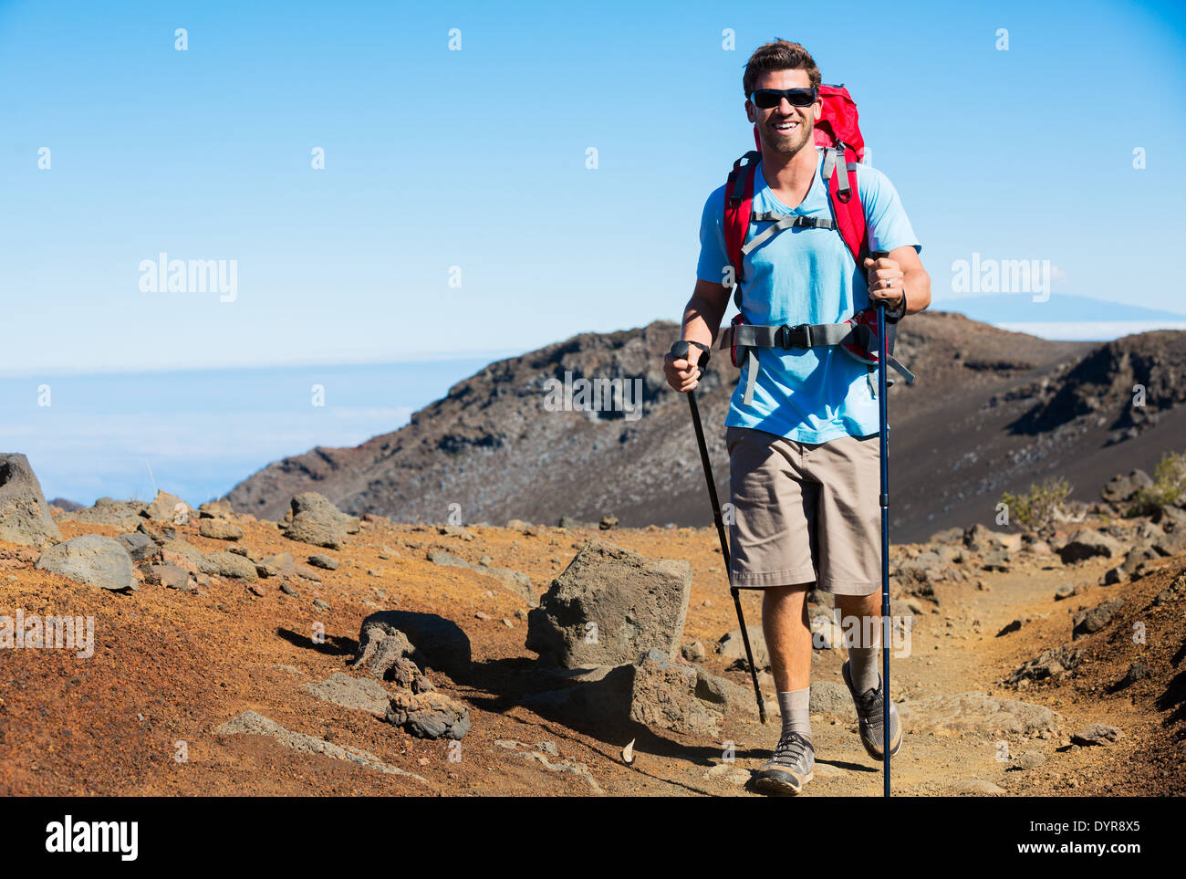 Hiker with backpack in the mountains Stock Photo - Alamy