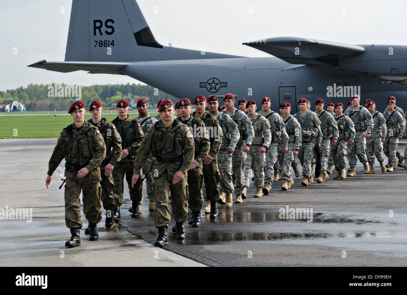 US Army paratroopers with the 173rd Airborne Brigade Combat Team arrive march alongside the ...