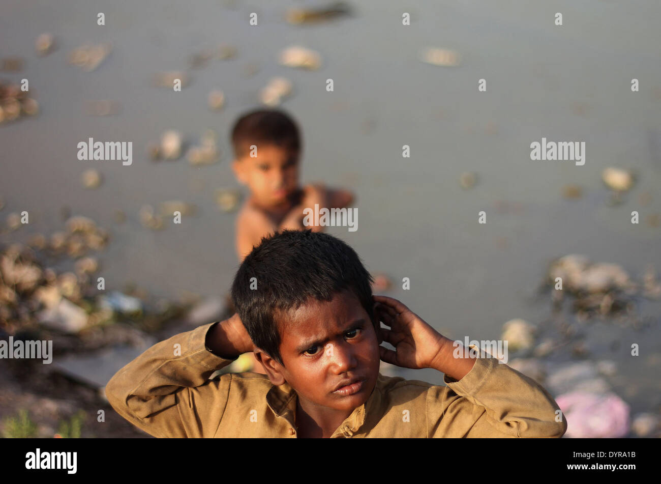LAHORE, PAKISTAN, APRIL 24: Pakistani gypsy children playing in the dry ...