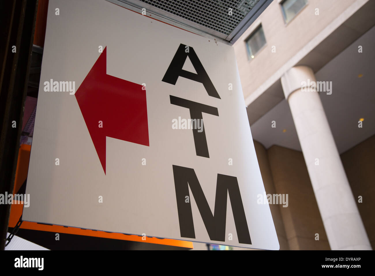 white ATM sign with arrow Stock Photo - Alamy