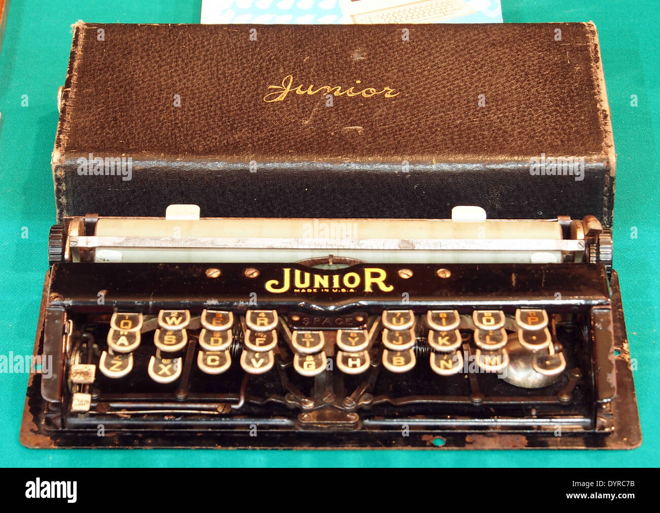 The Junior typewriter is a vintage mechanical typing machine designed ...