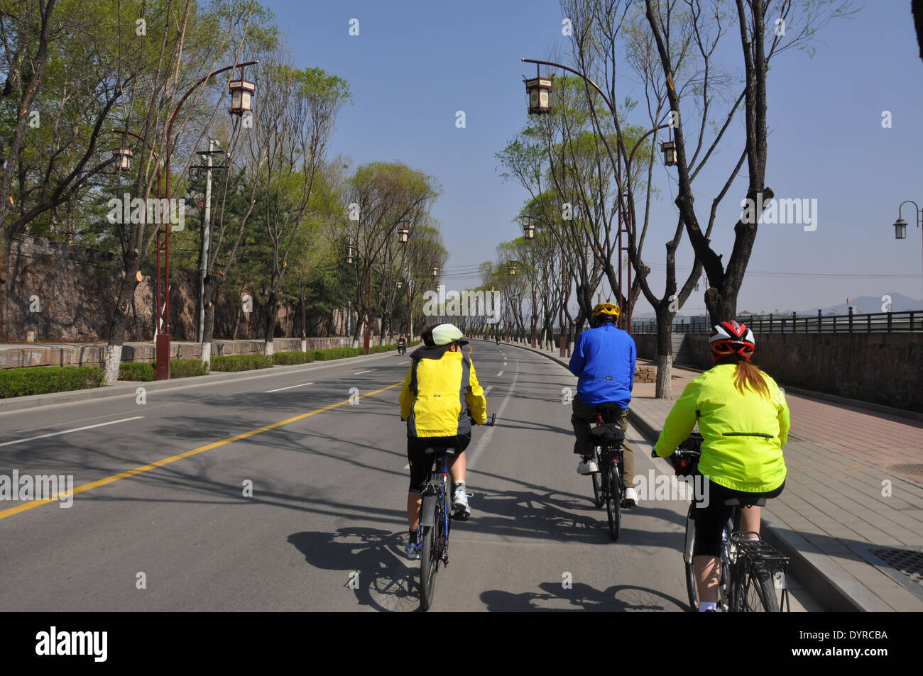 Australians cyclists and their guide on a cycle tour of China riding in ...