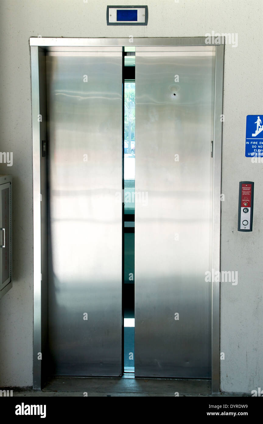 Stainless steel elevator doors closing hi-res stock photography and ...